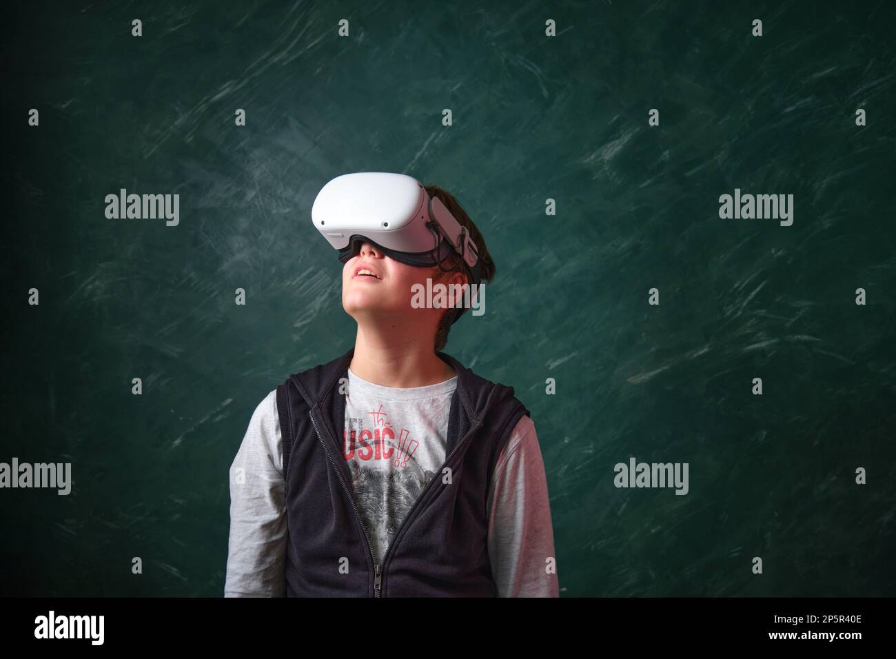 a boy playing with VR headset Stock Photo - Alamy