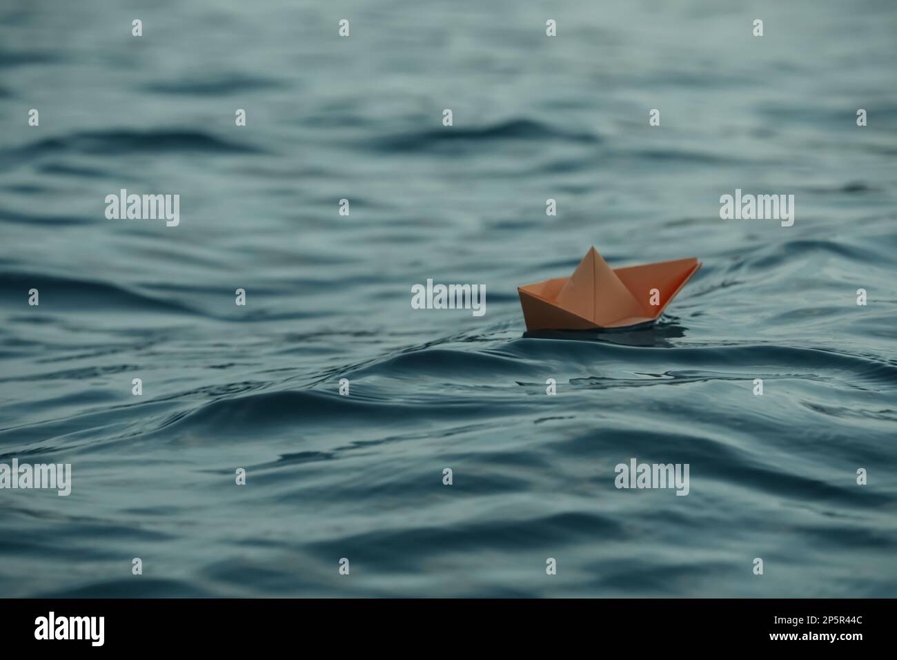 Paper boat floating on water outdoors. Space for text Stock Photo - Alamy