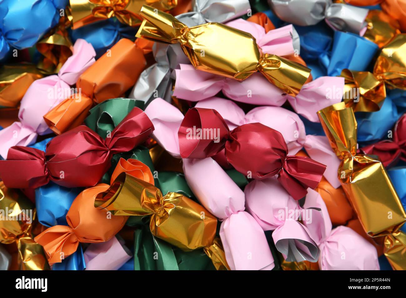 Many candies in colorful wrappers as background, closeup Stock Photo ...
