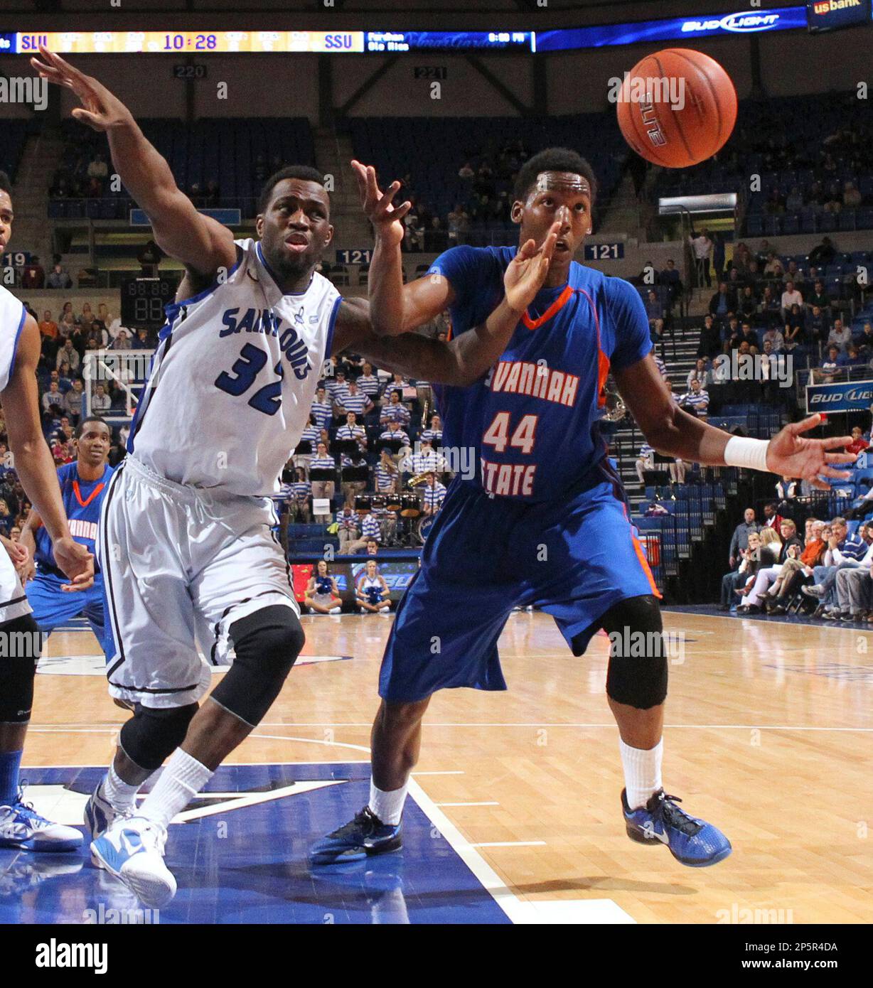 Saint Louis forward Cory Remekun, left, competes for a loose ball ...