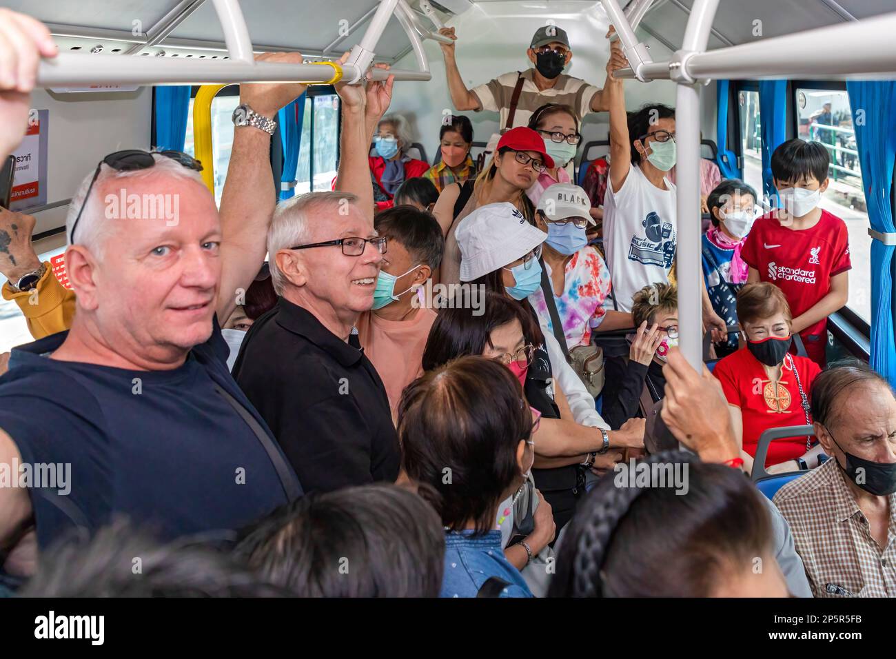 Foreign and Thai passengers on electric bus shuttle service, Bangkok ...