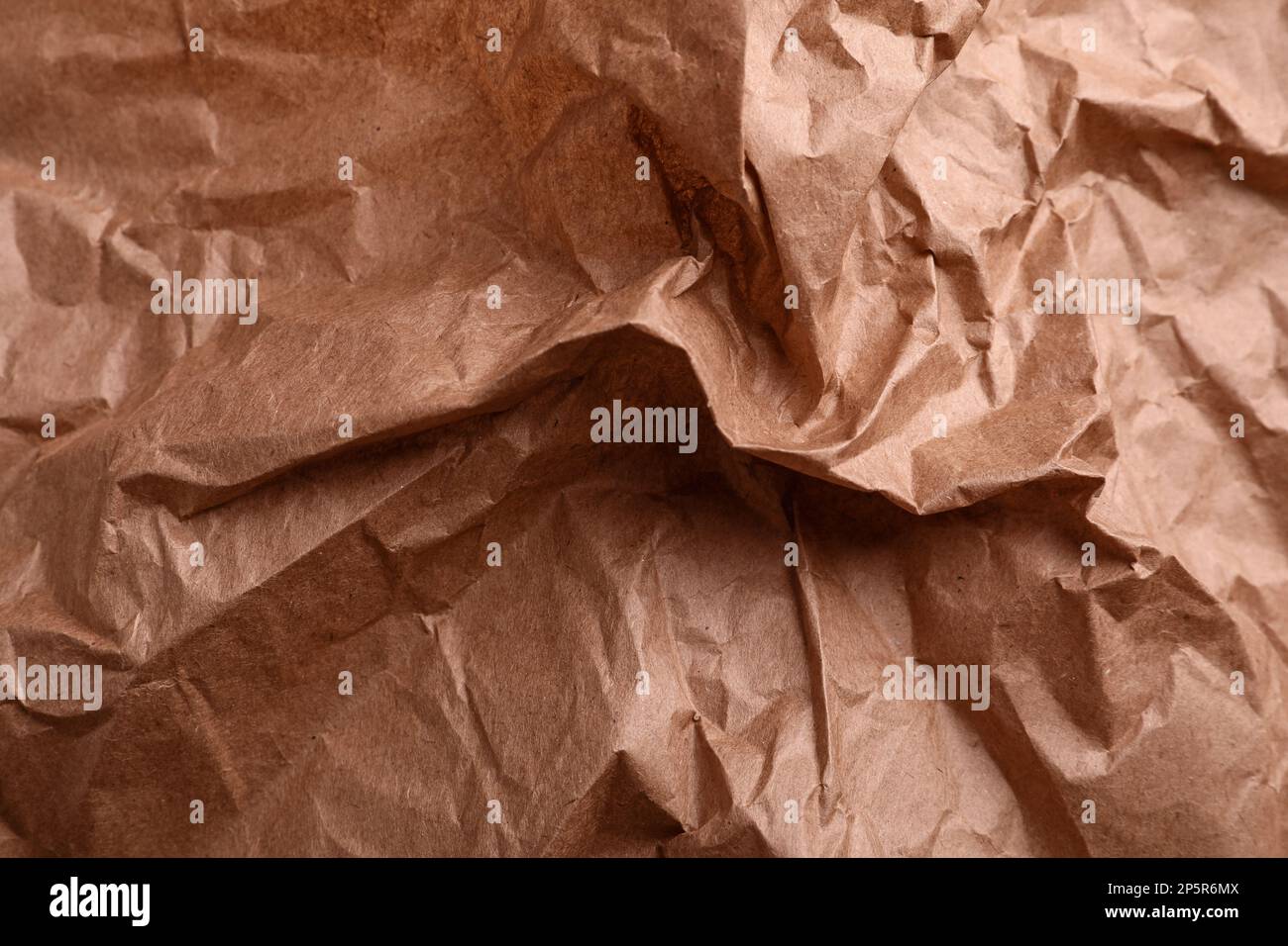 Texture of wrinkled kraft paper bag as background, closeup Stock Photo ...
