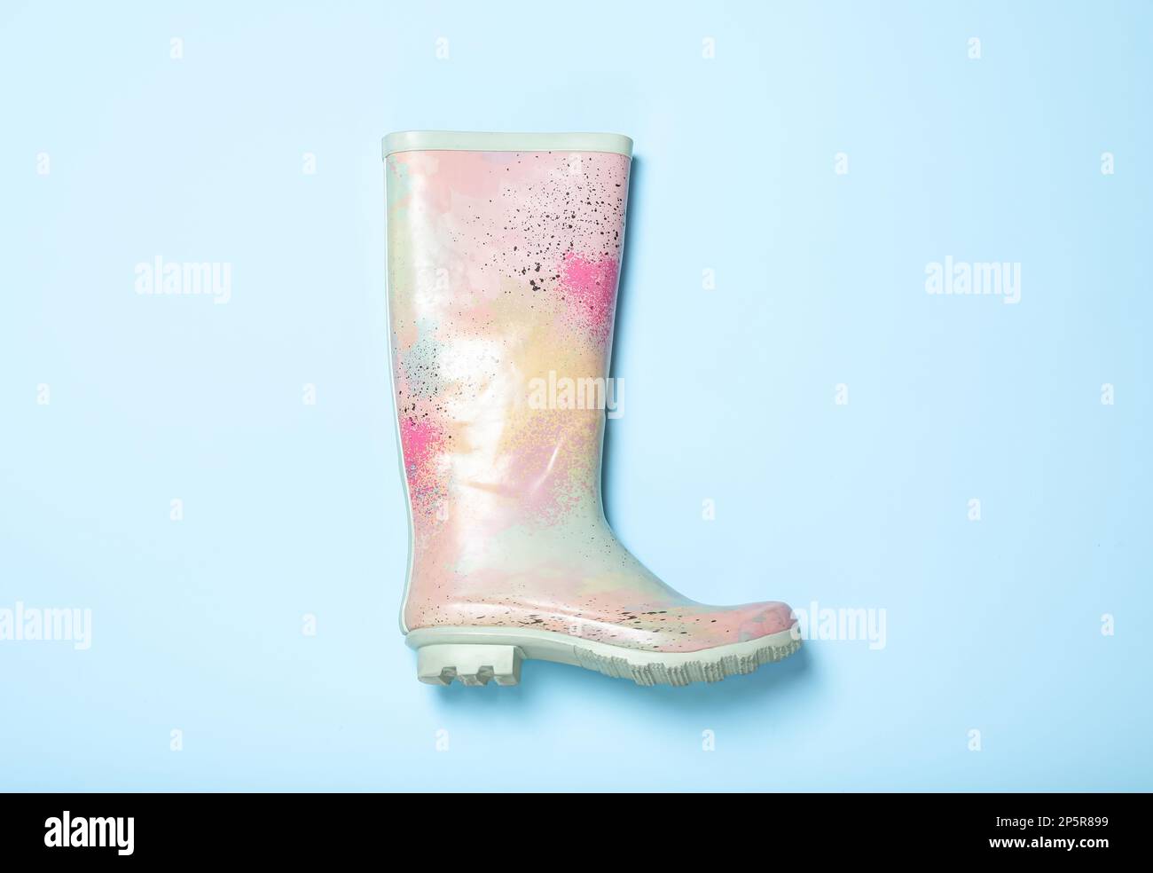 Colorful rubber boot on light blue background, top view Stock Photo - Alamy