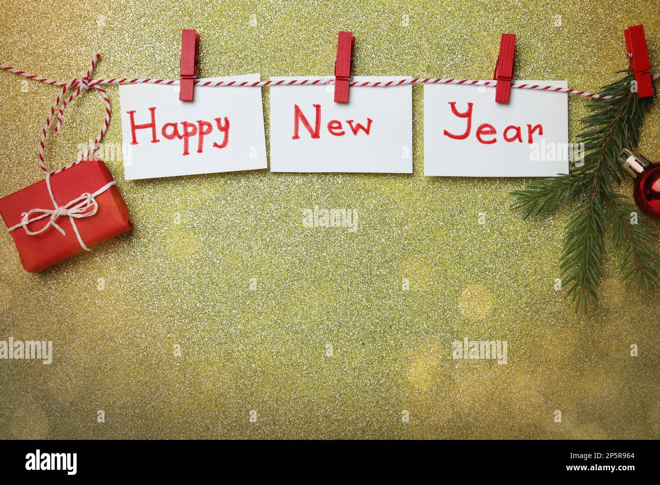 Happy New Year greeting card. Paper notes with words and decor on shiny ...