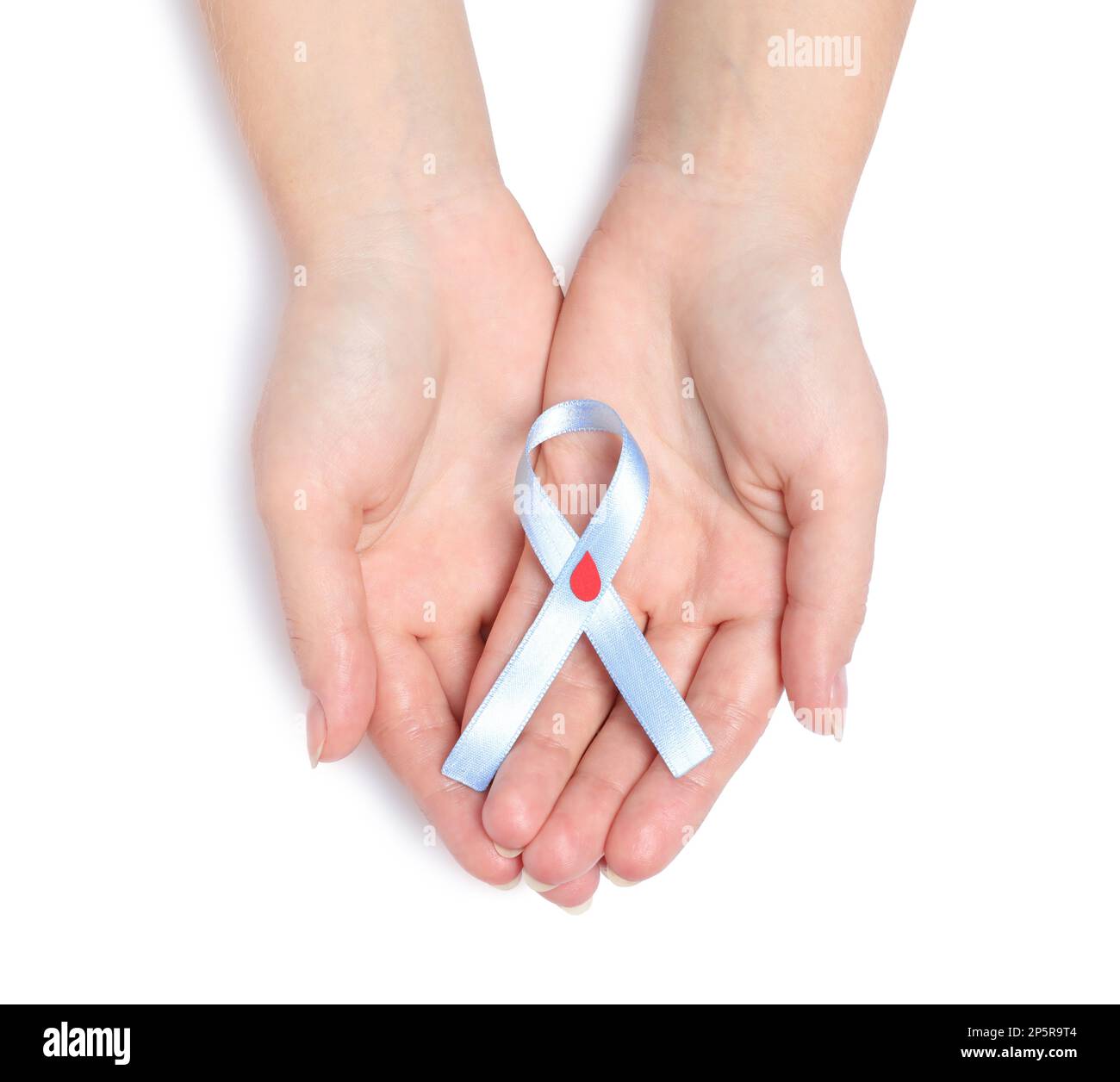Woman holding light blue ribbon with paper blood drop on white ...