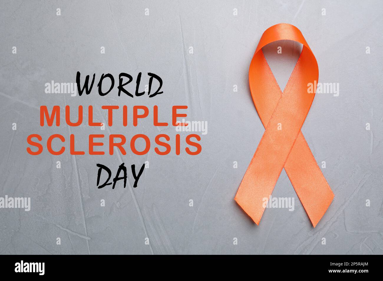 Multiple Sclerosis Awareness Day. Orange ribbon on light grey ...