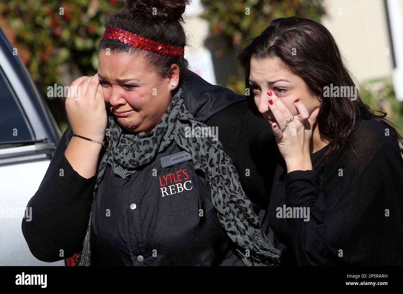 Jazmine Taylor, 18, and Taylor Dardis, 17, cry outside of the Petaluma ...