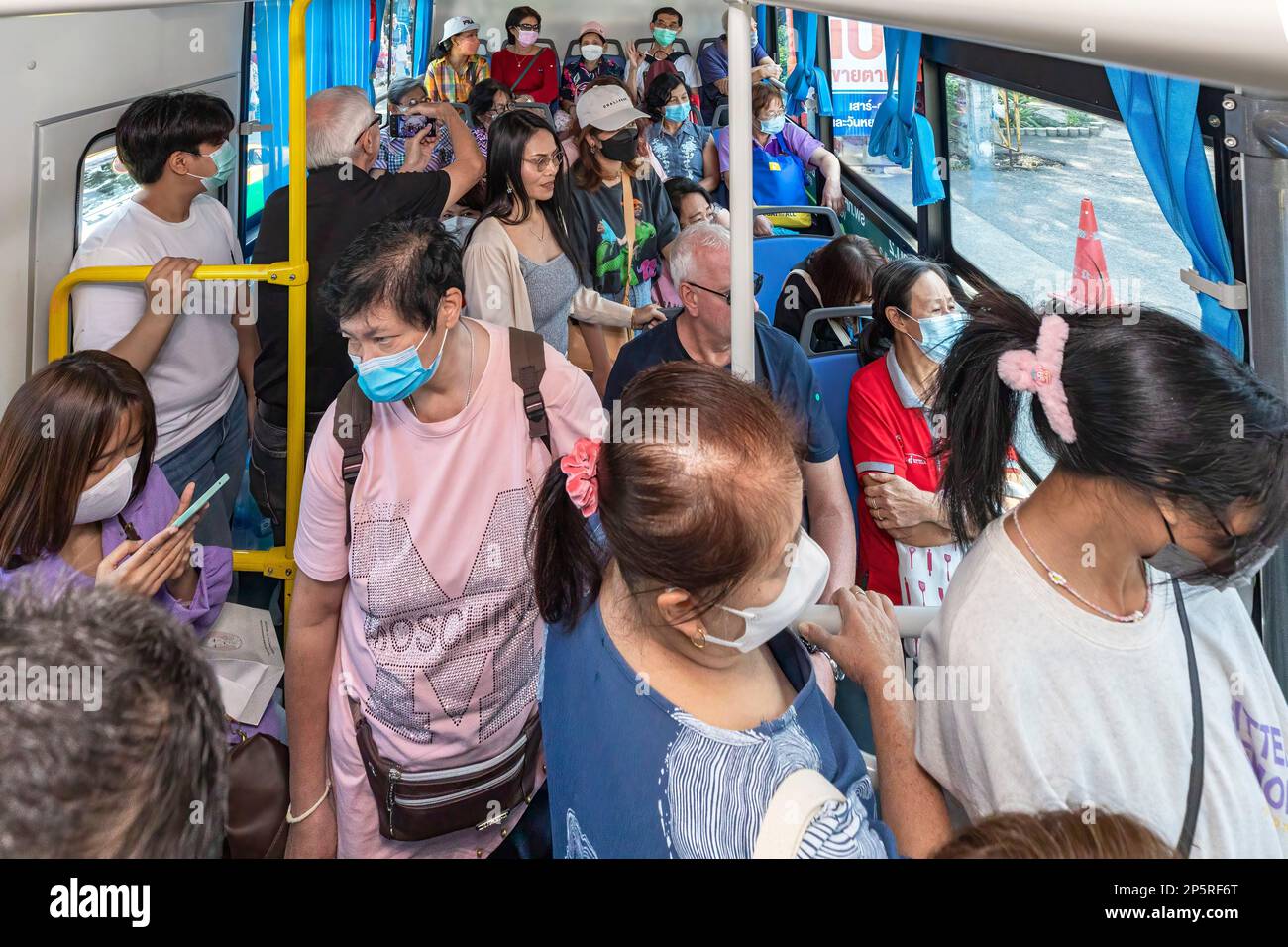 Foreign and Thai passengers on electric bus shuttle service, Bangkok ...