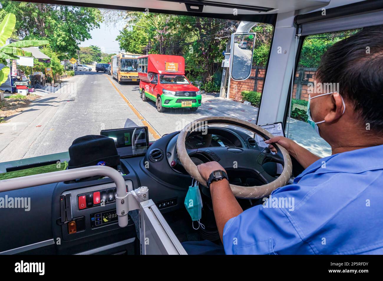 Thai driver of electric shuttle bus traveling around Bangkok floating ...