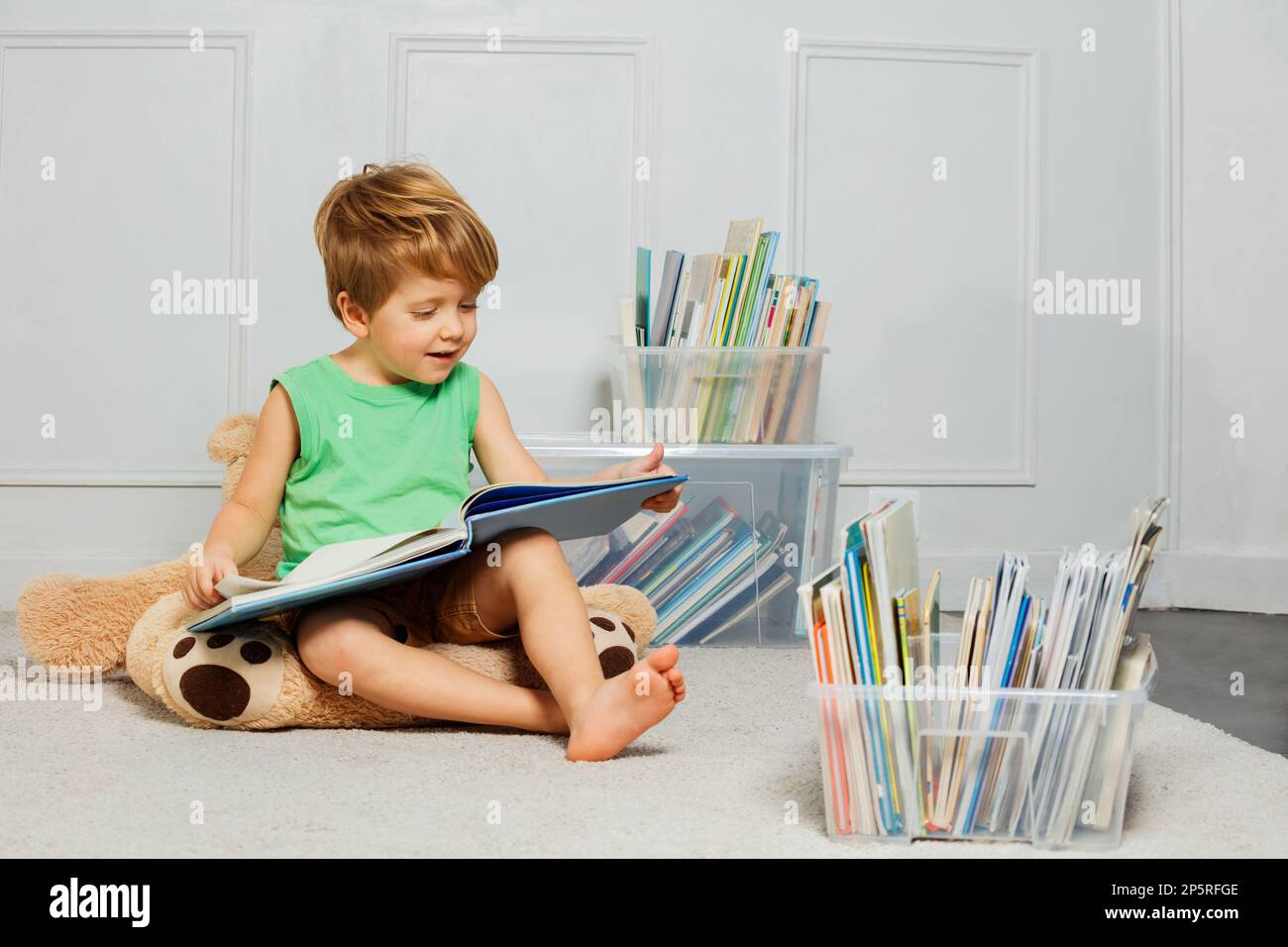 Child being read to hi-res stock photography and images - Alamy