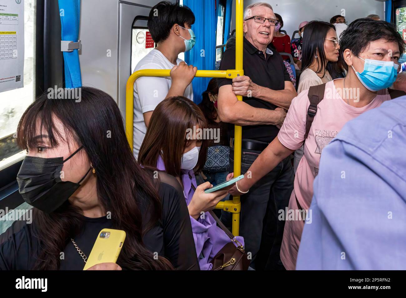 Foreign and Thai passengers on electric bus shuttle service, Bangkok ...