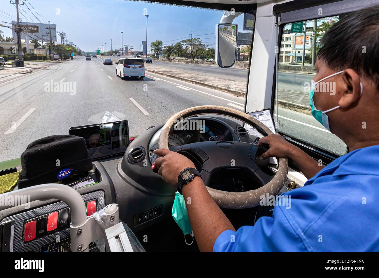 Thai driver of electric shuttle bus traveling around Bangkok floating ...