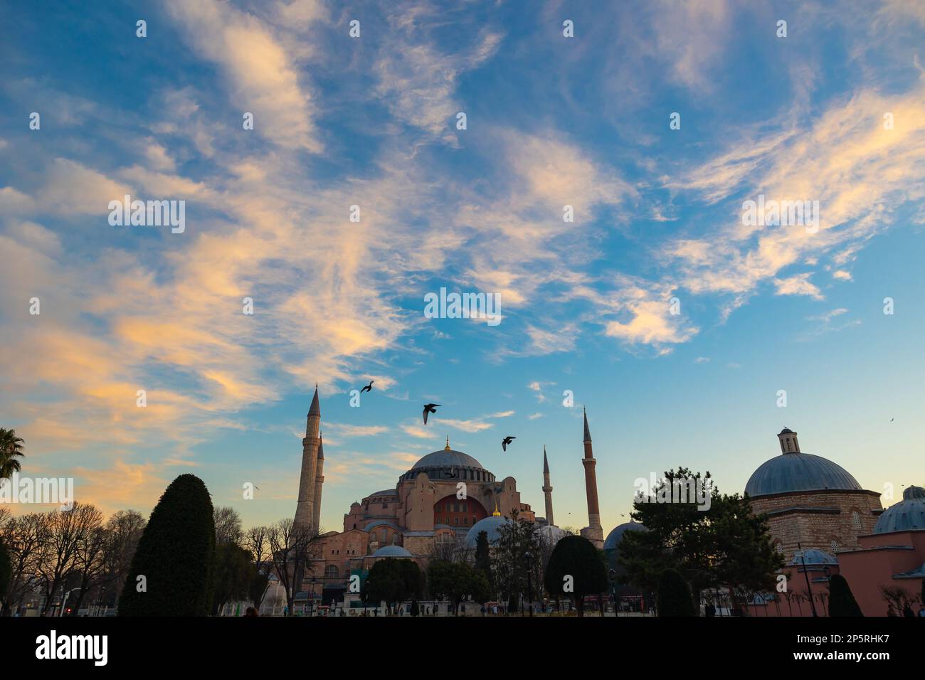 Hagia Sophia and birds with dramatic clouds at sunrise in the morning ...