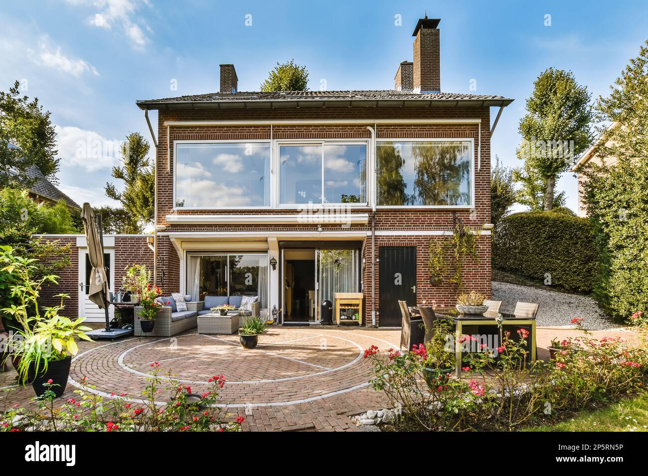 a house in the netherlands with an outdoor patio and brick pavered ...