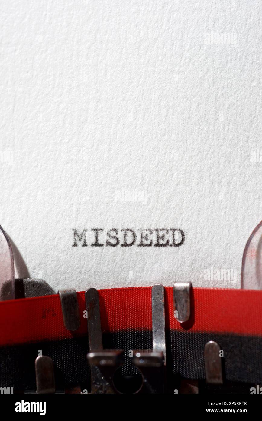 Misdeed word written with a typewriter Stock Photo - Alamy