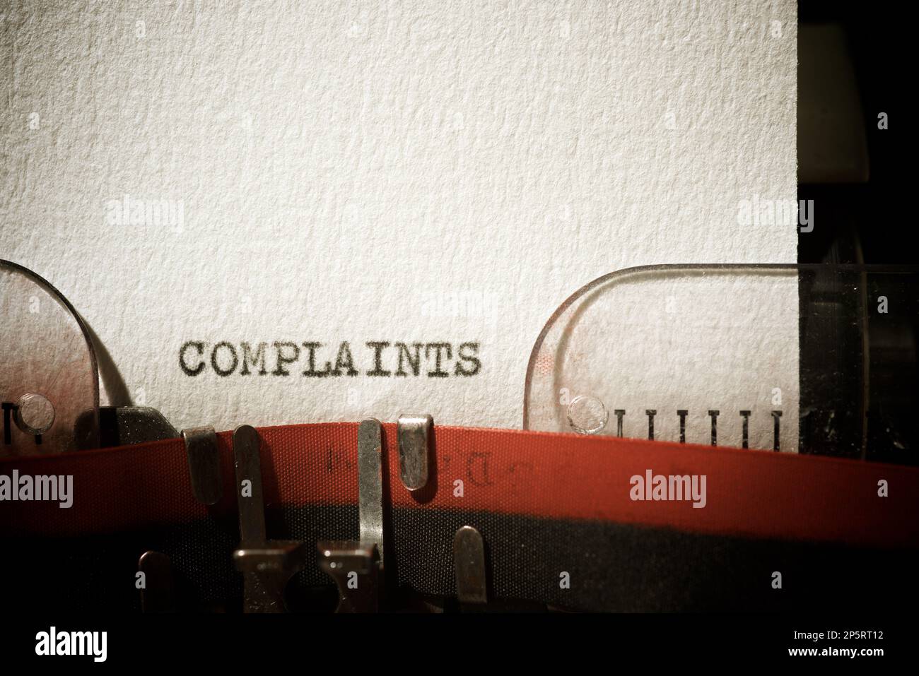 Complaints word written with a typewriter Stock Photo - Alamy