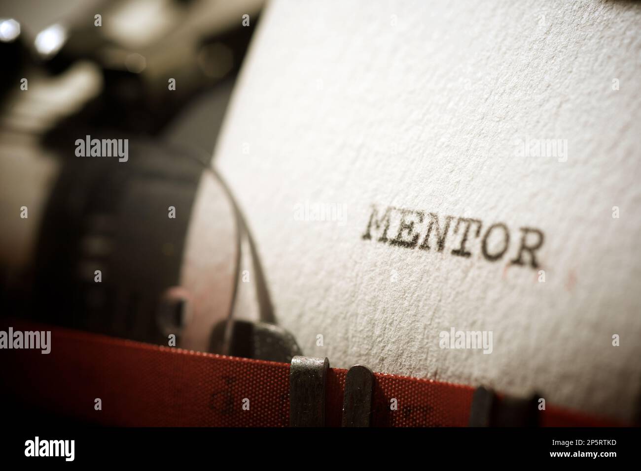 Mentor word written with a typewriter Stock Photo - Alamy