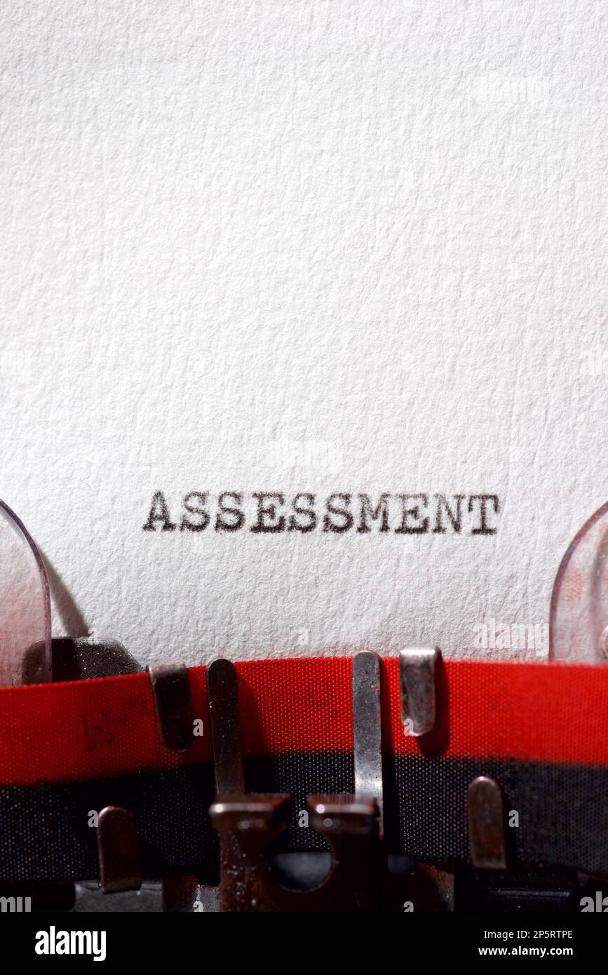 Assessment word written with a typewriter Stock Photo - Alamy