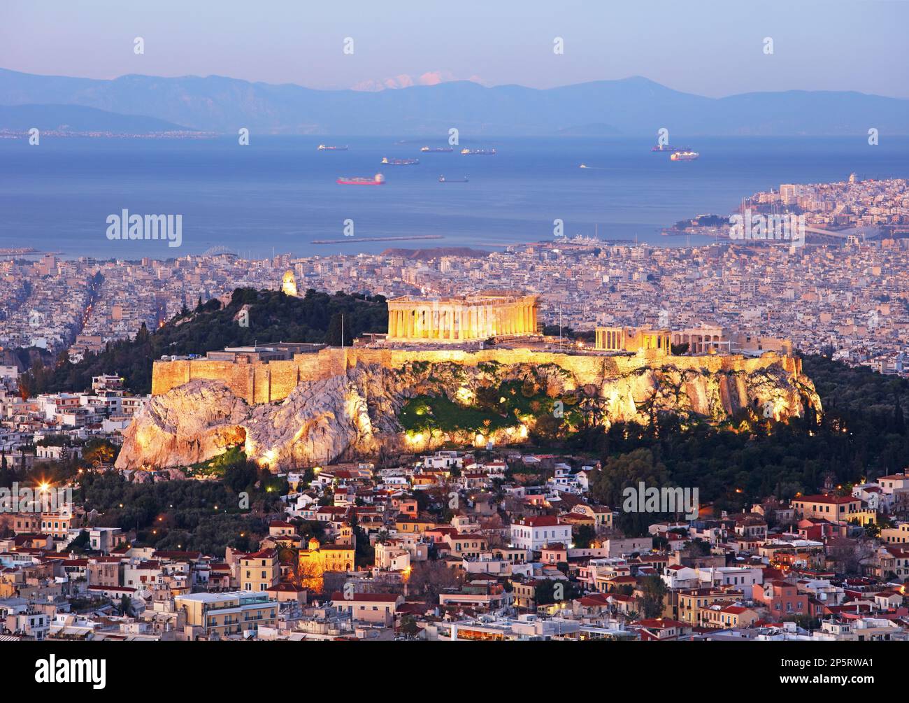 Cityscape of Athens with illuminated Acropolis hill, Pathenon and sea ...