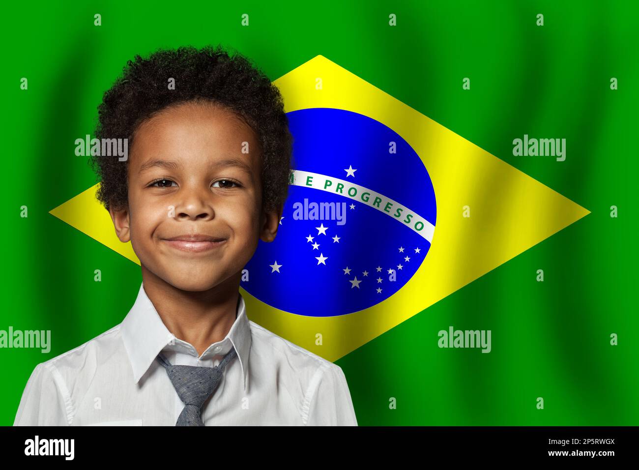 Brazilian kid boy on flag of Brazil background. Education and childhood ...