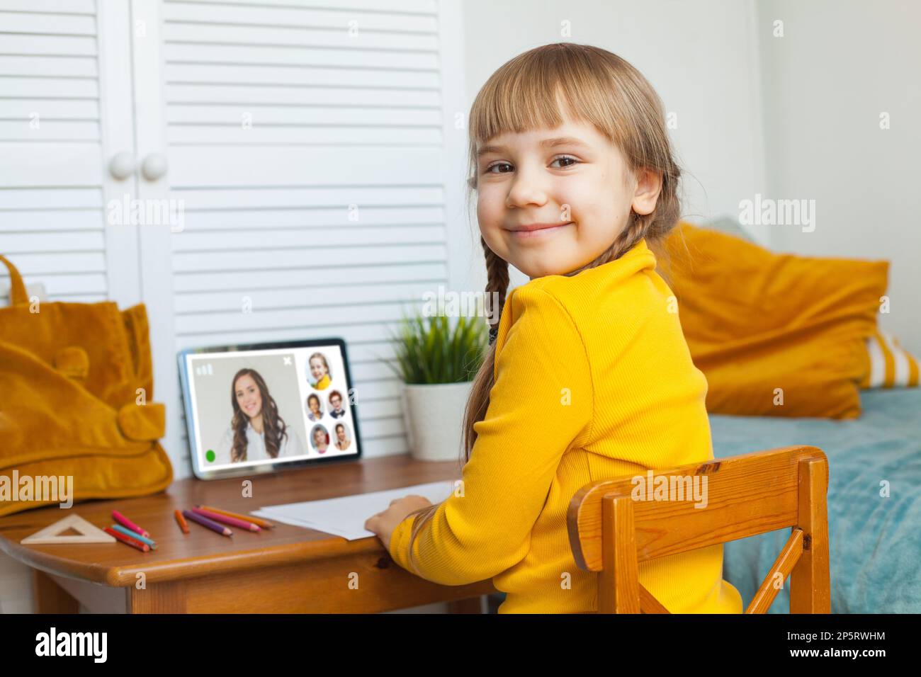 Happy child girl learning at home Stock Photo - Alamy