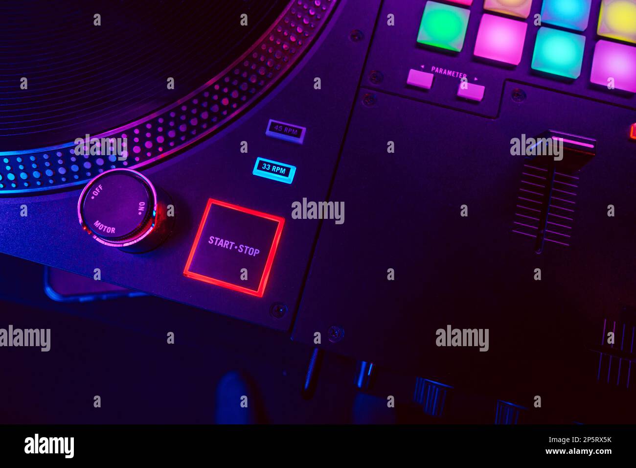 Close up of DJ mixing console in party light Stock Photo - Alamy