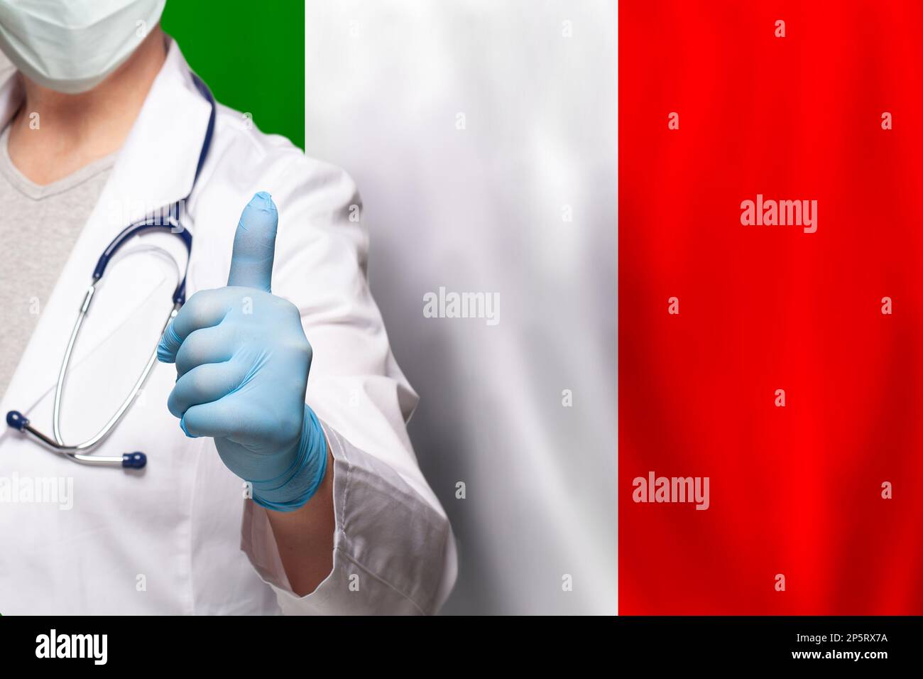 Italian doctor's hand showing thumb up positive gesture on flag of ...