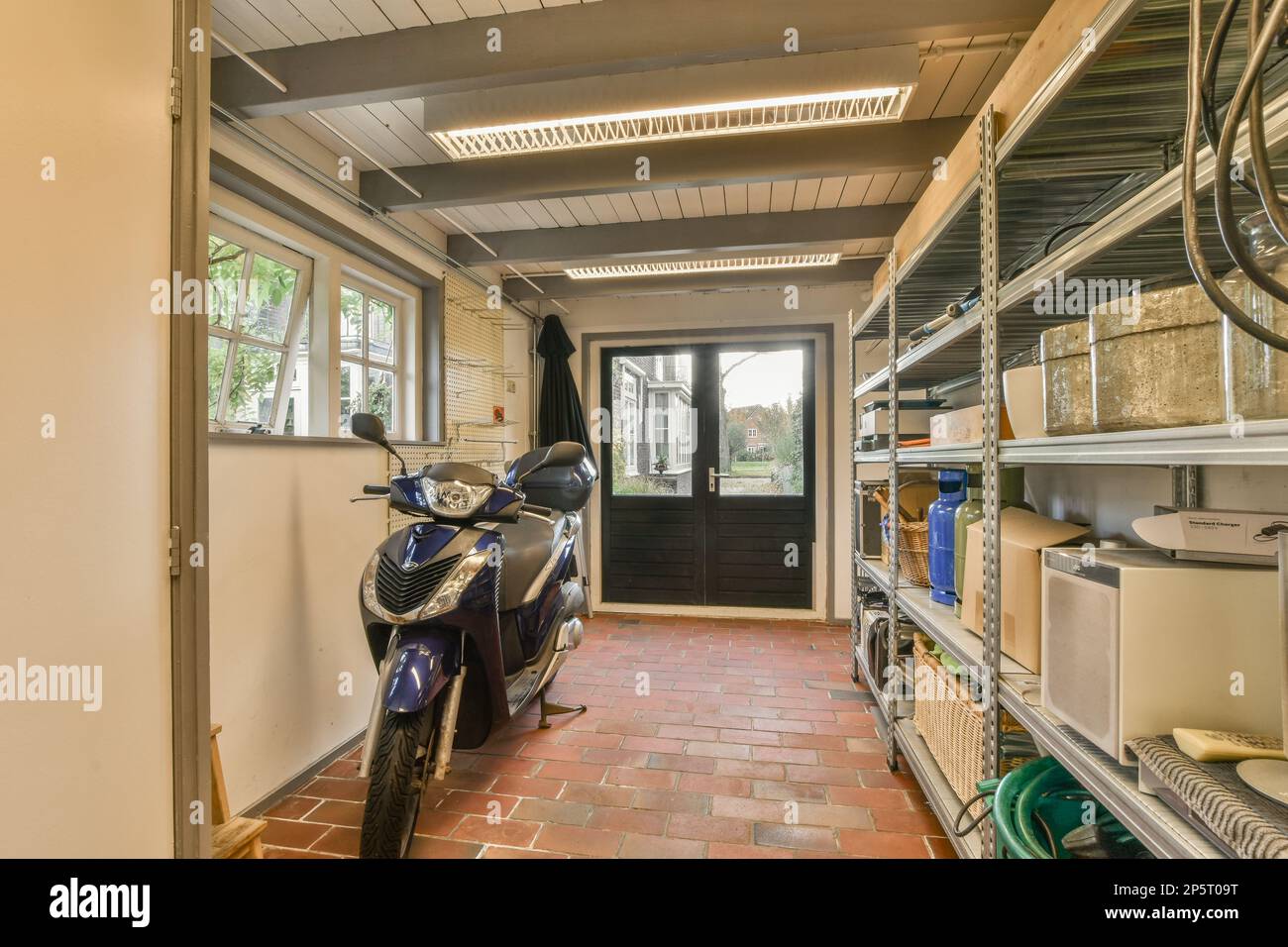 the inside of a house with a motorcycle parked in front of it and an ...