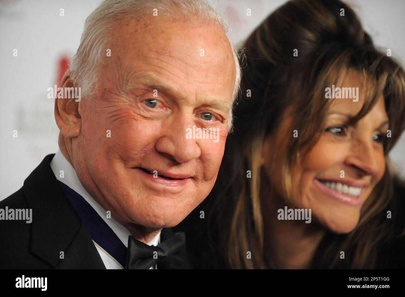 BEVERLY HILLS, CA - JANUARY 07: Buzz Aldrin (L) and guest arrive at St ...