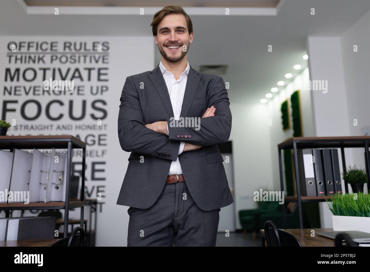 portrait of a successful male lawyer standing in an office building ...