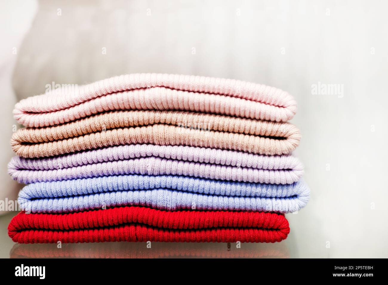 beautifully folded knitted multi-colored things. wardrobe Stock Photo ...
