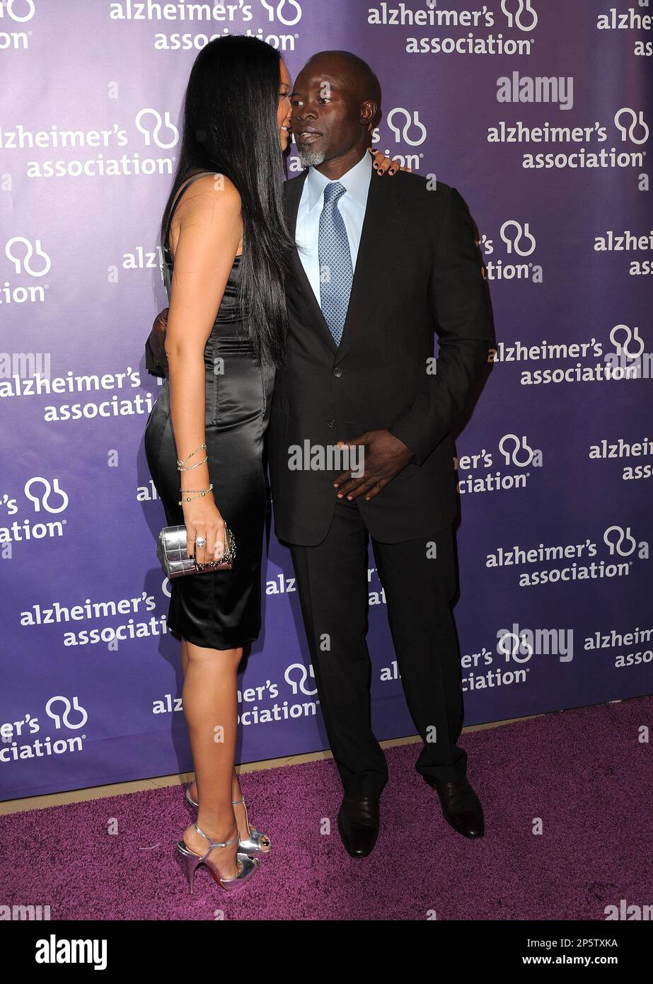 BEVERLY HILLS, CA - MARCH 16: Kimora Lee and Djimon Hounsou attend the ...