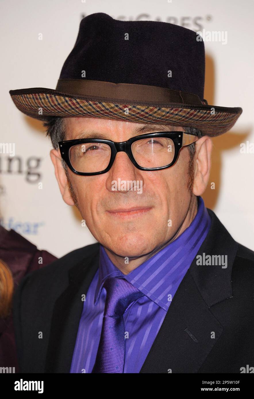 LOS ANGELES, CA - FEBRUARY 11: Actor Elvis Costello arrives at the 2011 ...
