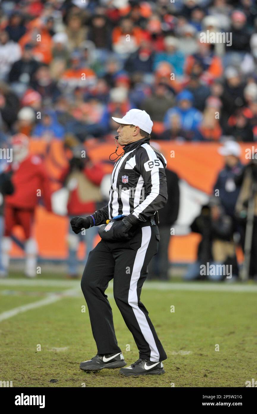NFL referee Ed Hochuli (85) whistles play into action in the NFL game ...