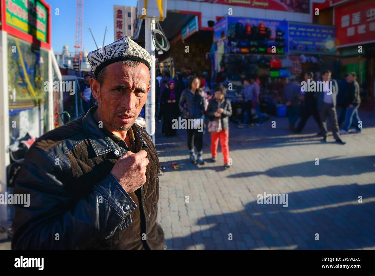 Residents wearing Uyghur traditional turbans and square caps on the ...