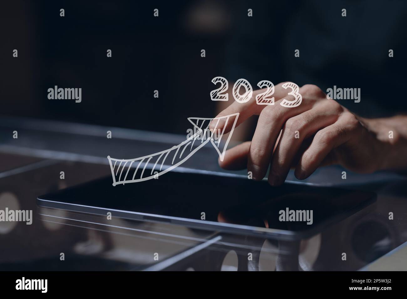 Business man hand on tablet PC screen with arrow grow up chart graph ...