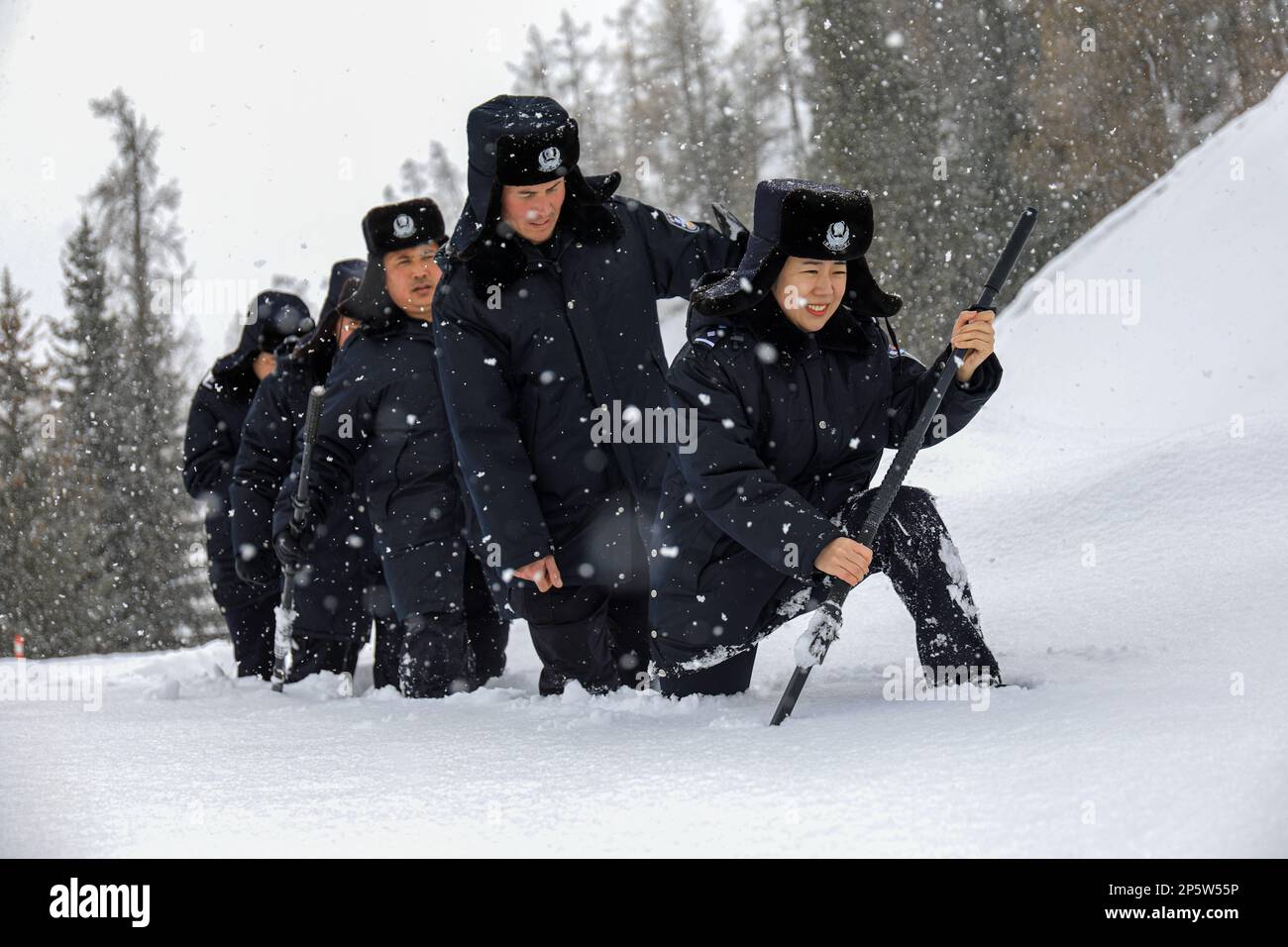 ALTAY, CHINA - MARCH 7, 2023 - A policewoman and policemen patrol a ...