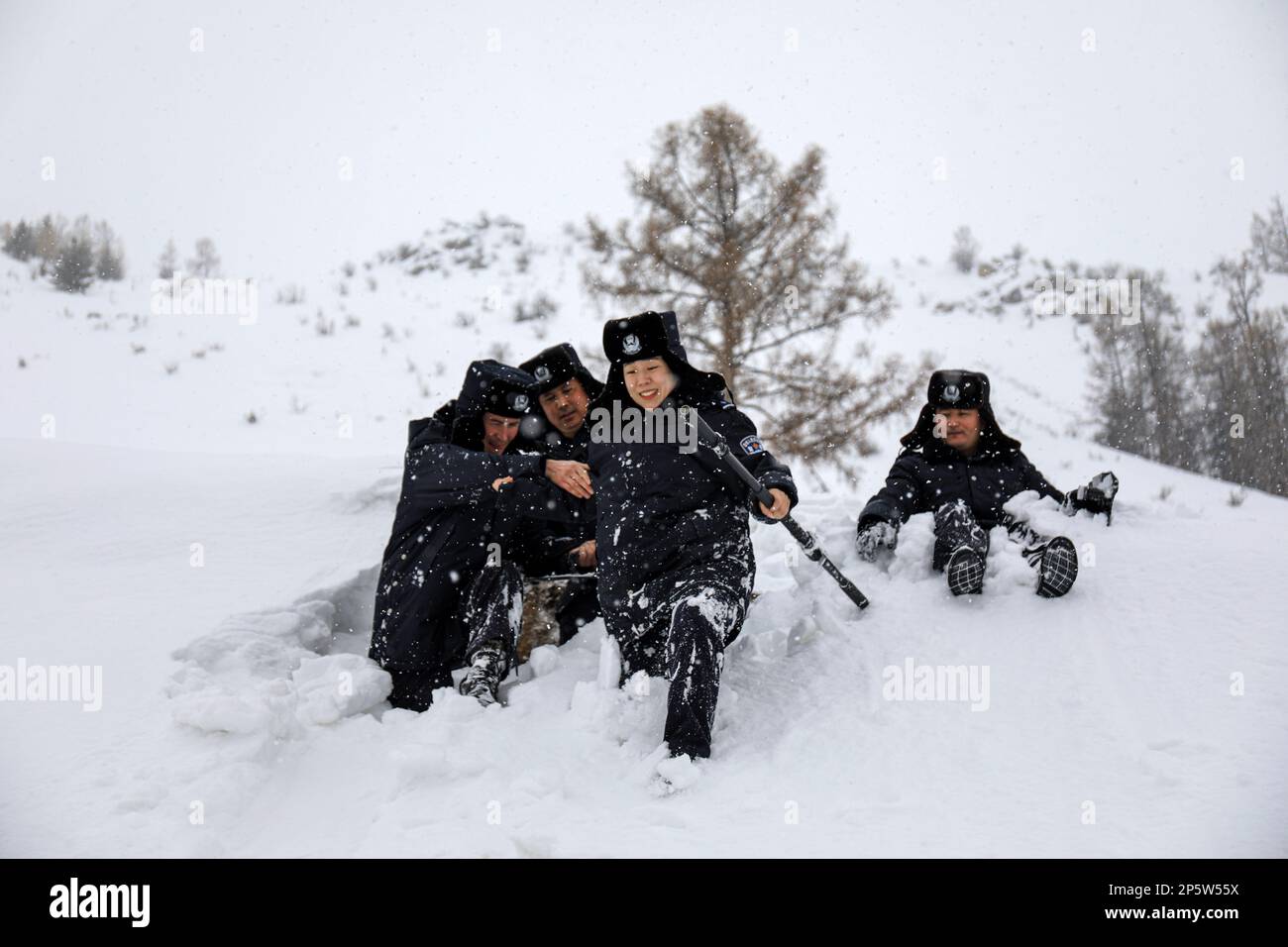 ALTAY, CHINA - MARCH 7, 2023 - A policewoman and policemen patrol a ...