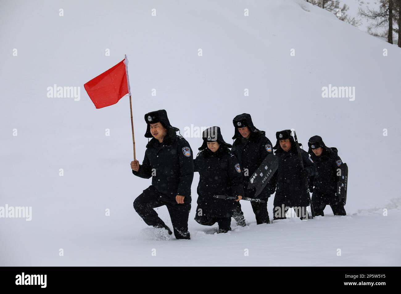 ALTAY, CHINA - MARCH 7, 2023 - A policewoman and policemen patrol a ...