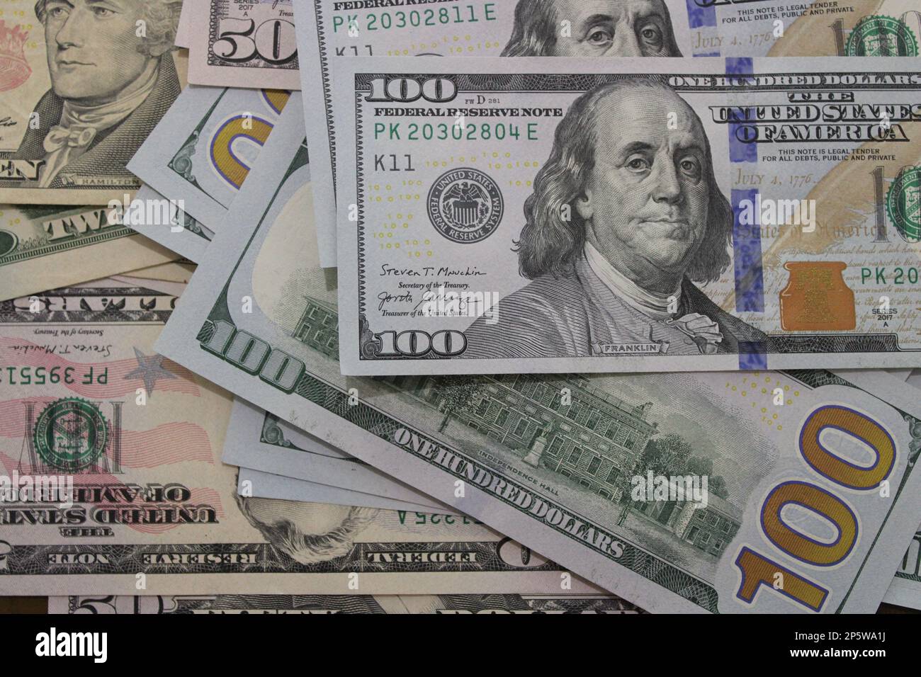 Pile of US dollar bills of varying monetary value Stock Photo - Alamy