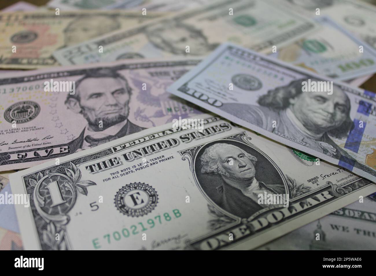 Pile of US dollar bills of varying monetary value Stock Photo - Alamy