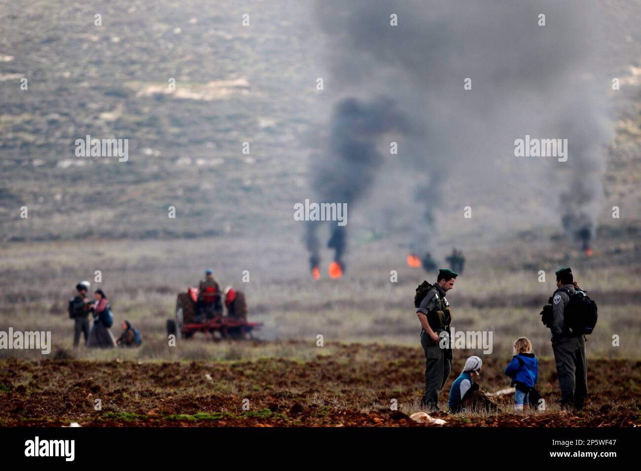 Surrounded by Israeli border police Jewish settlers from the Esh Kodesh ...