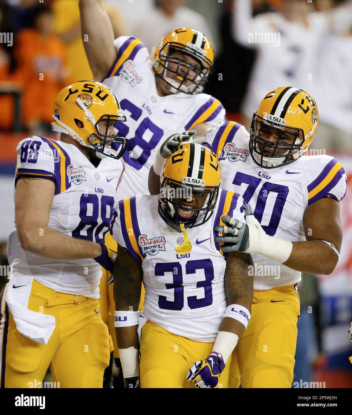 LSU running back Jeremy Hill (33) celebrates with teammates after he ...