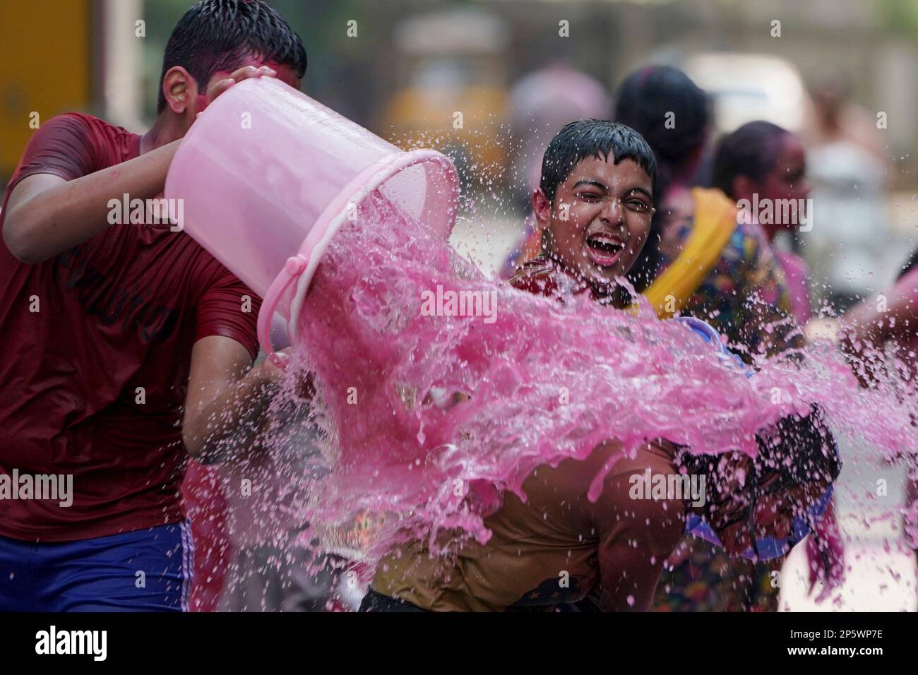 Children play with color water as they celebrate Holi, the Hindu ...