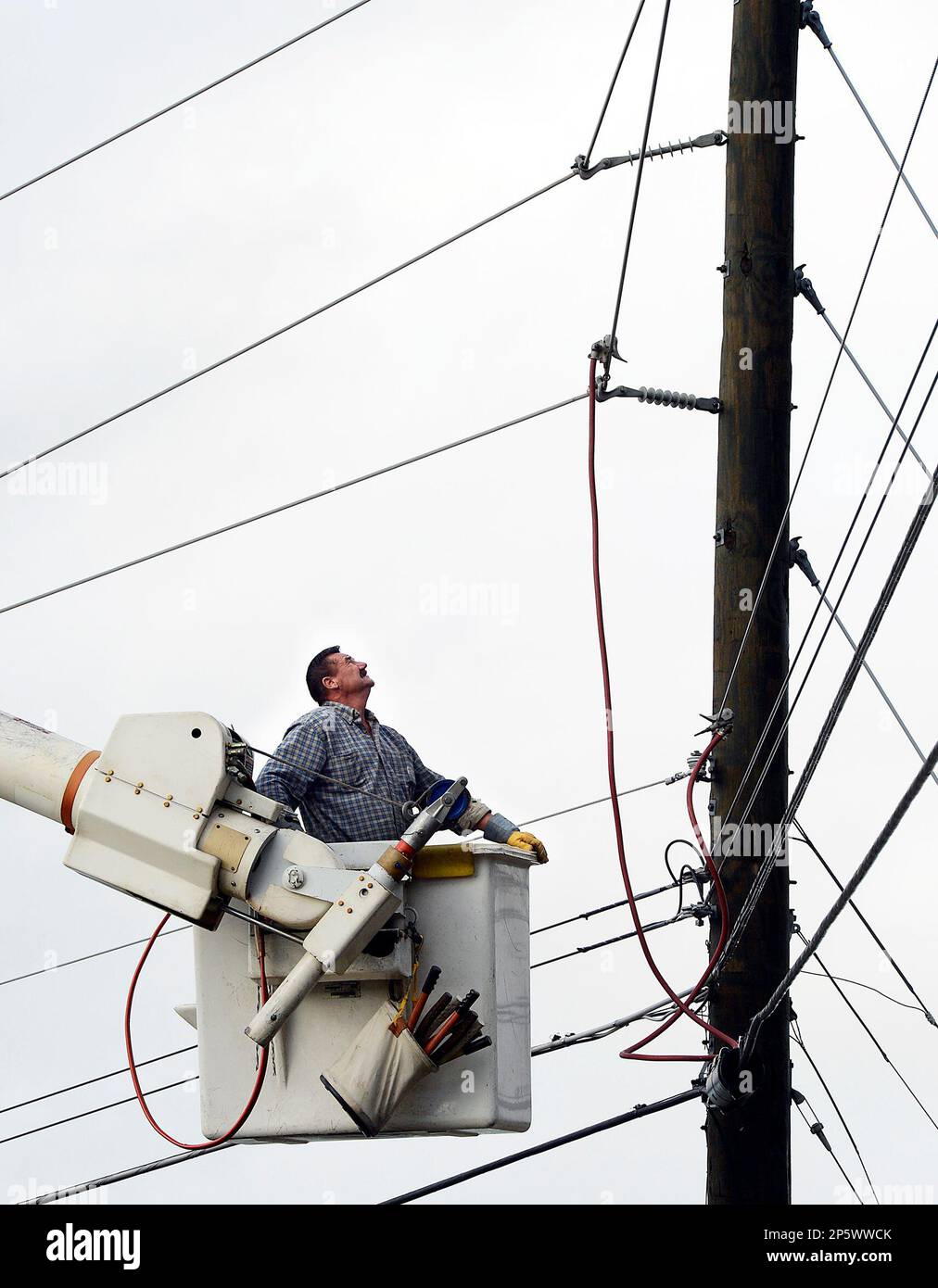 Power crews work to restore electrical service to customers in ...