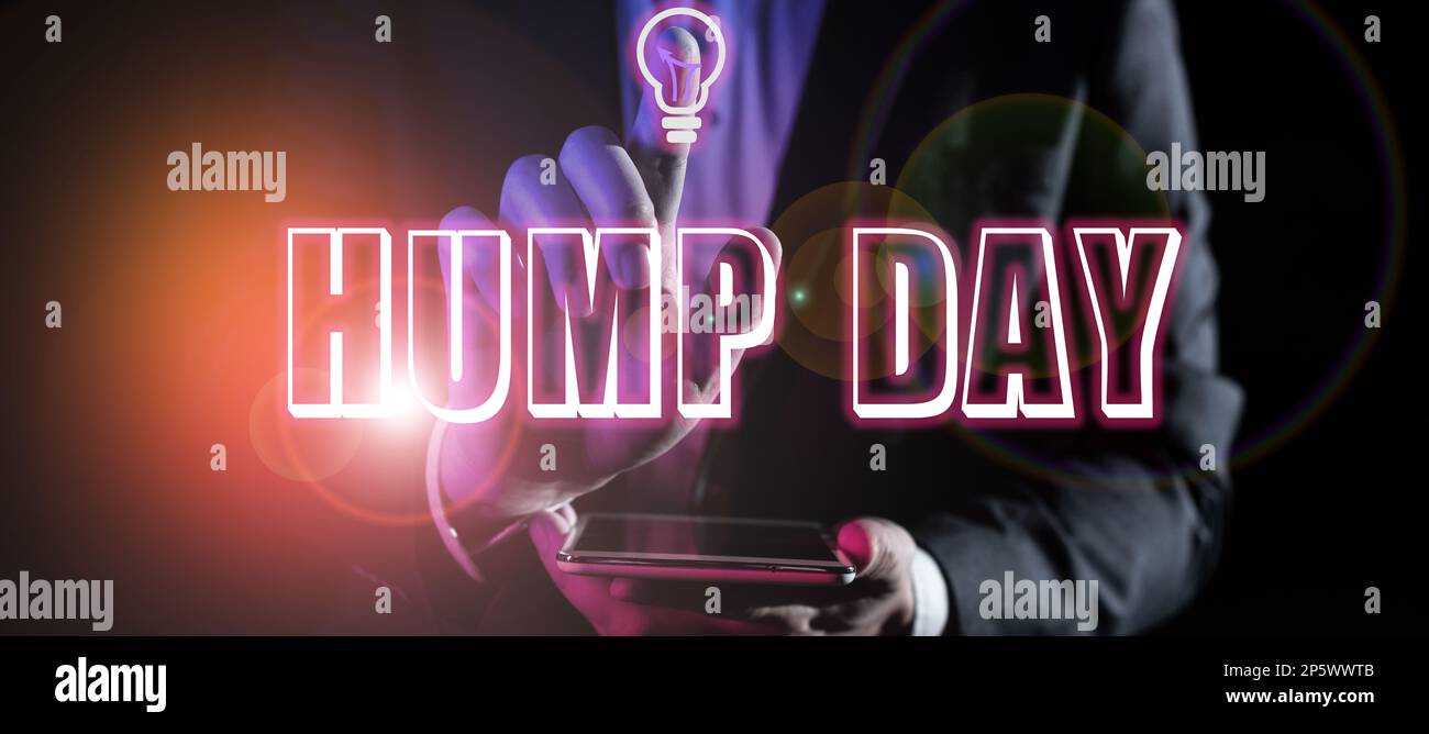 Hand writing sign Hump Day. Business showcase climbing a proverbial ...