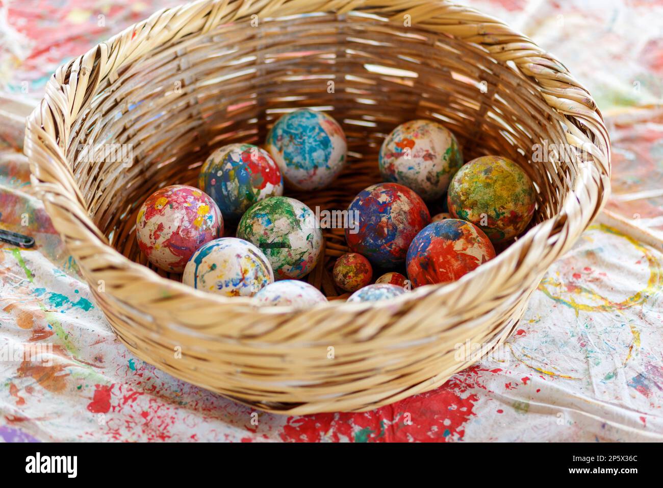 Child painting at art school. Education concept. Various painted balls ...