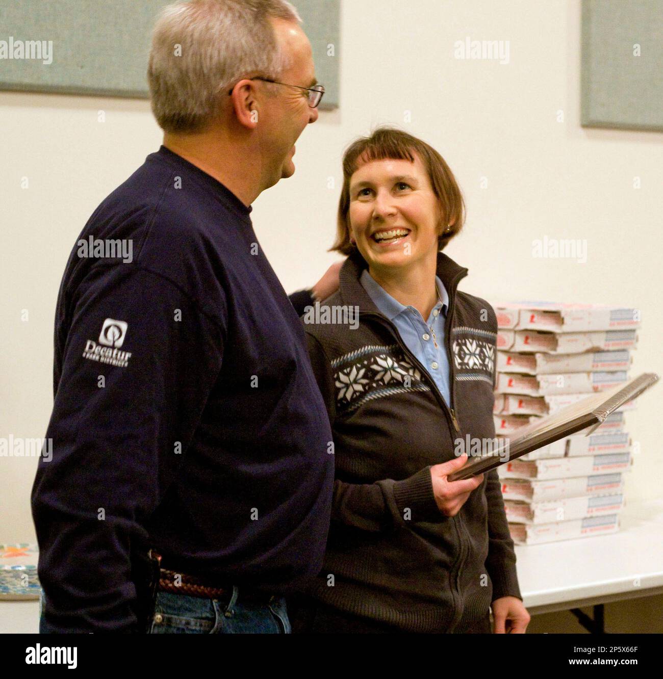 In this Dec. 5, 2012, photo, Mandy Podeschi, right, gets a hug and a ...