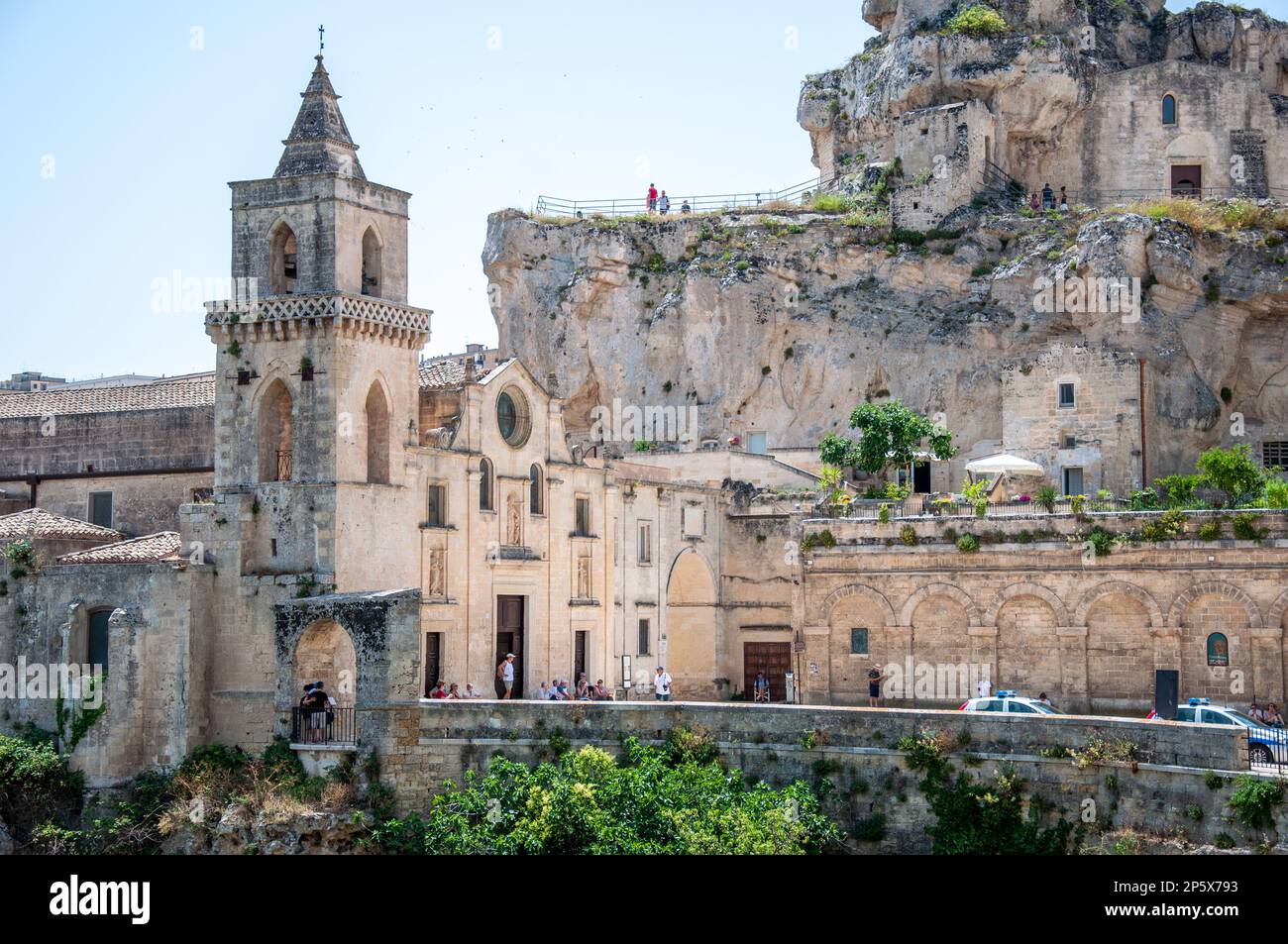 Ancient stone churches and cliffside dwellings meet beneath a bright ...