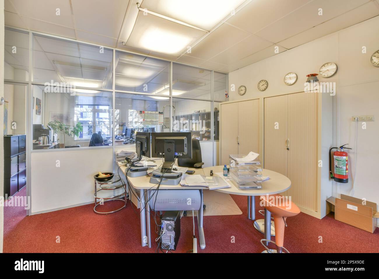 the inside of an office with desks, computers and other items on ...